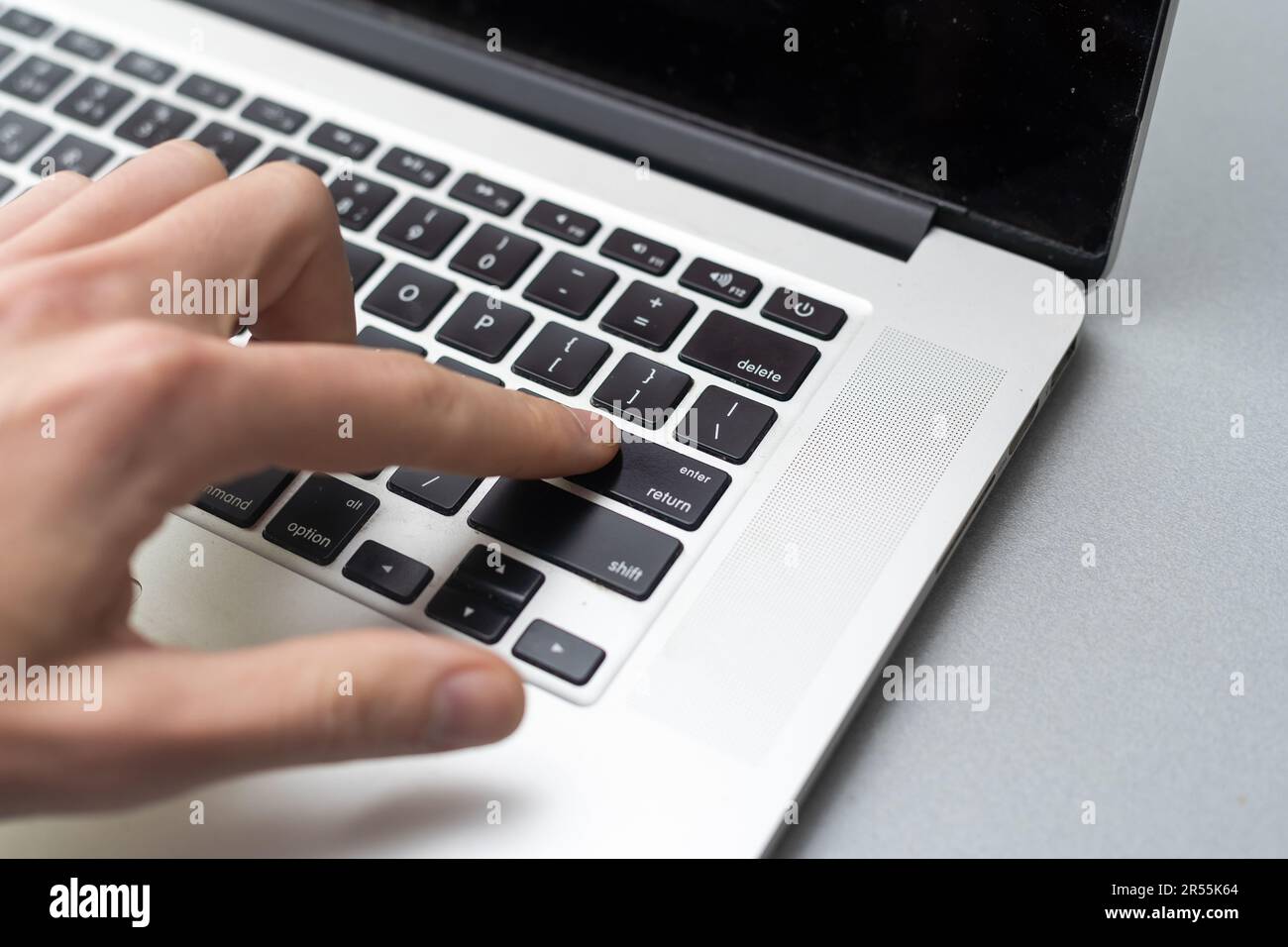 Finger pushing the button of keyboard Stock Photo - Alamy