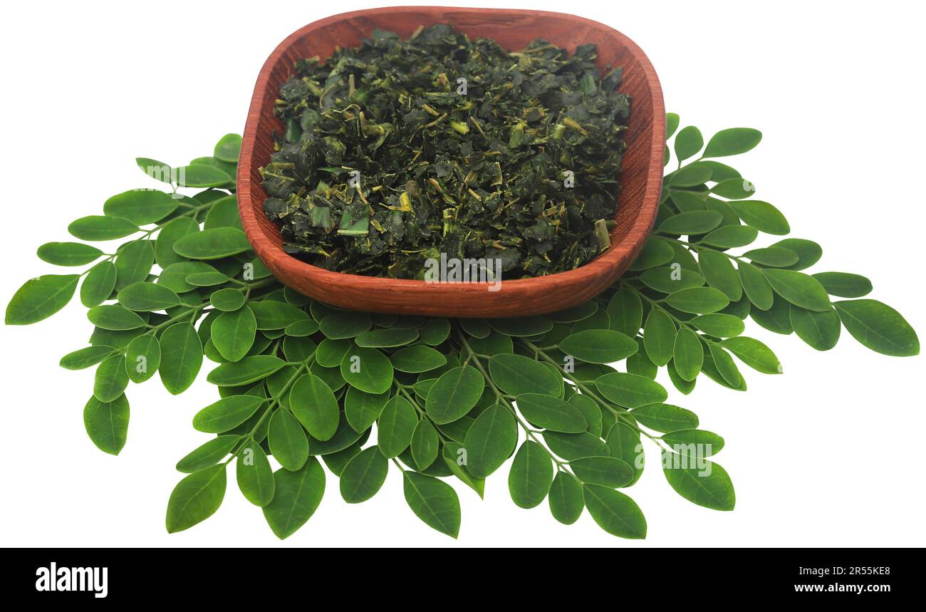Moringa leaves fresh and crushed in a bowl Stock Photo - Alamy