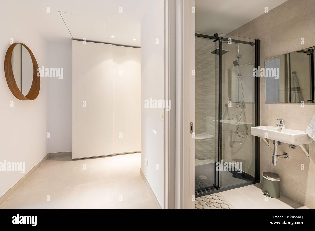 View from the corridor to the corner with wardrobe and mirror and ...