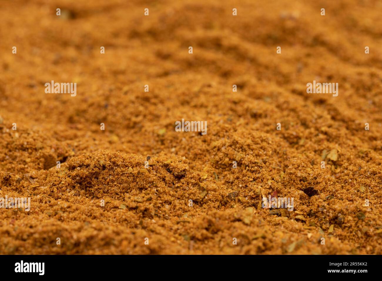 Pile of cajun powder as background, spice or seasoning as background ...