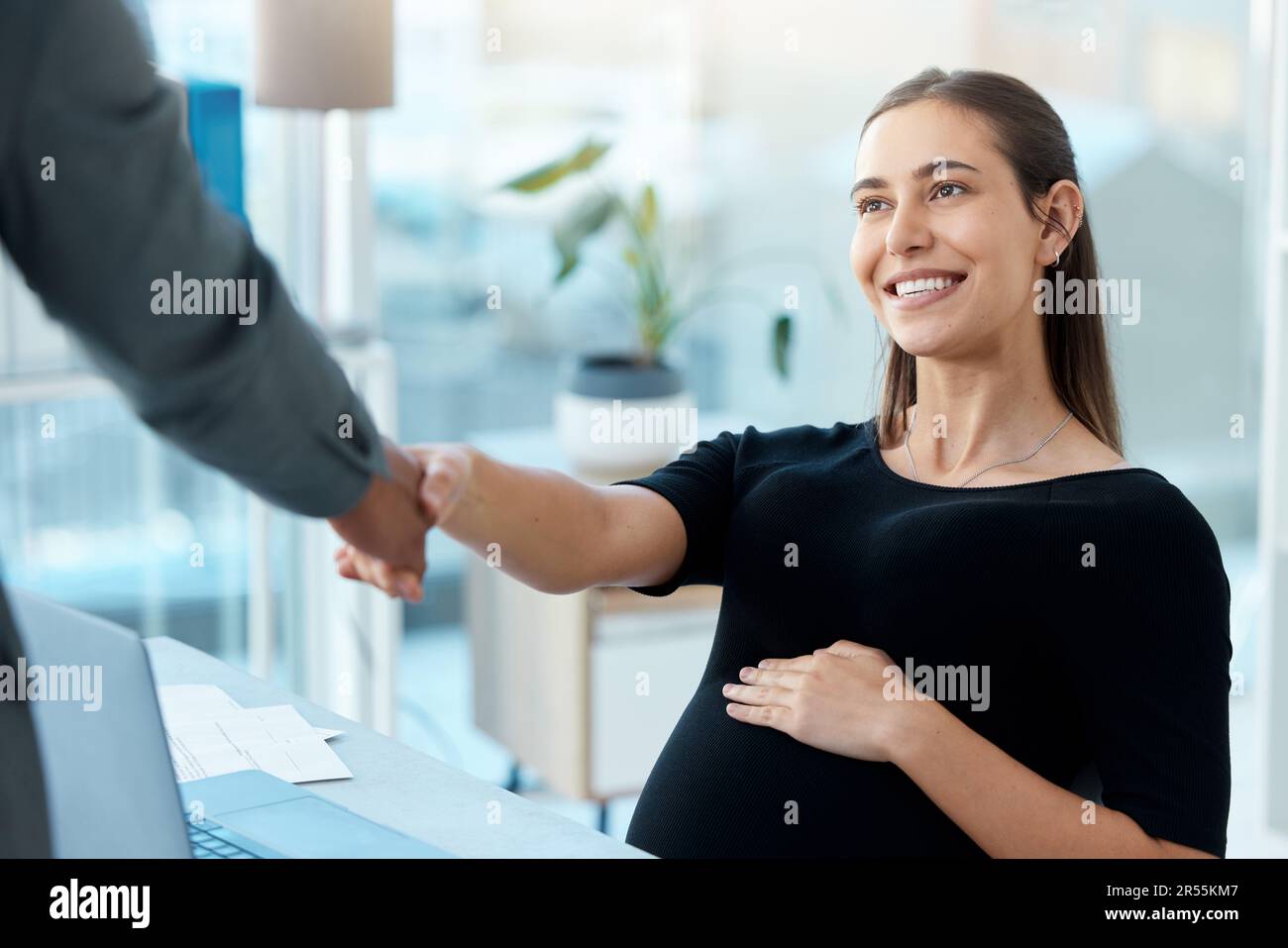 Pregnant business woman, hand shake and office with man, welcome or ...