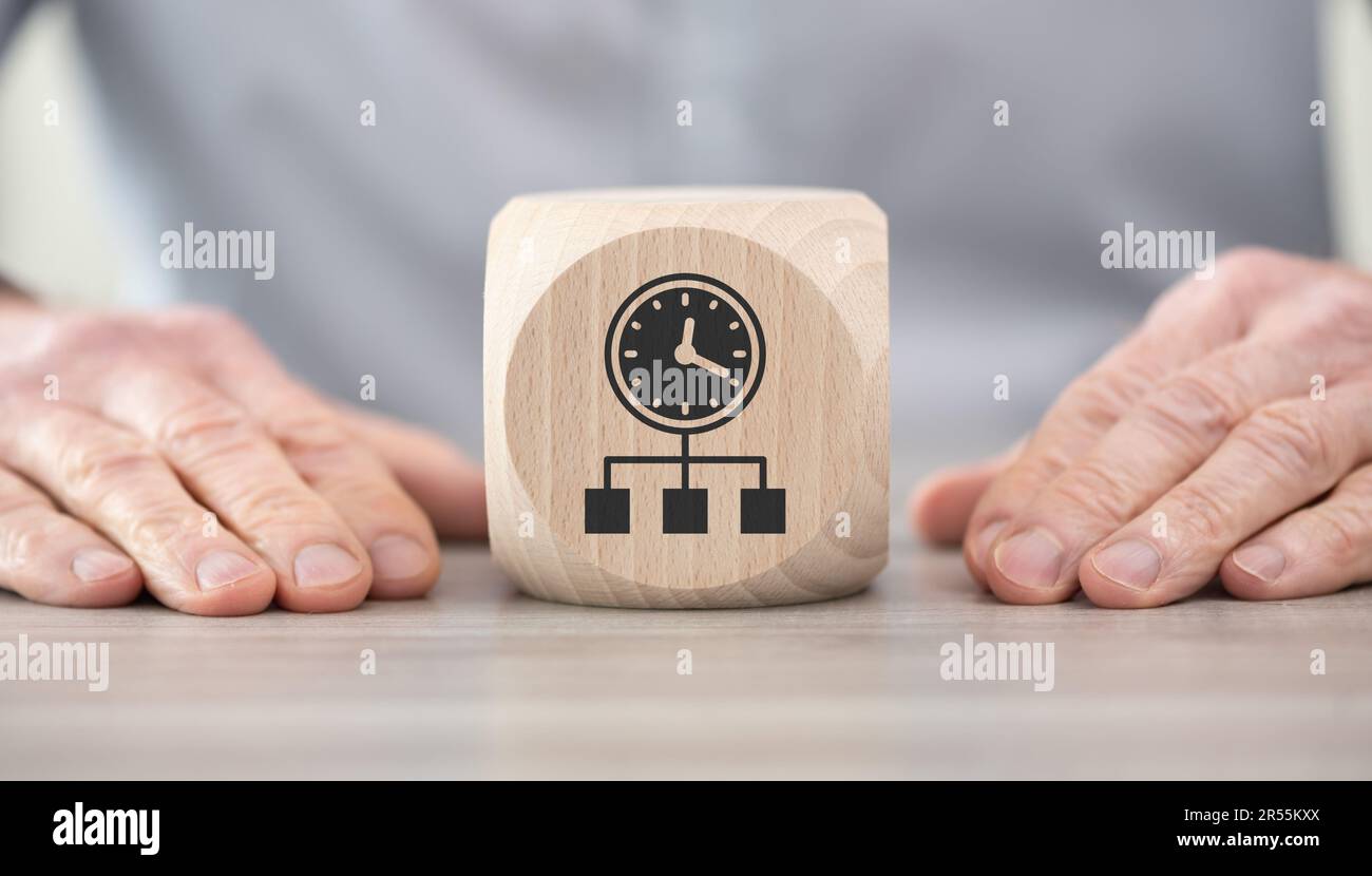 Wooden block with symbol of time management concept Stock Photo - Alamy