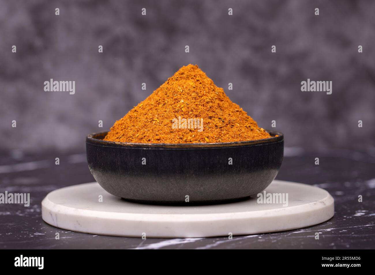 Cajun spice powder on dark background. Powdered dried cajun in bowl ...