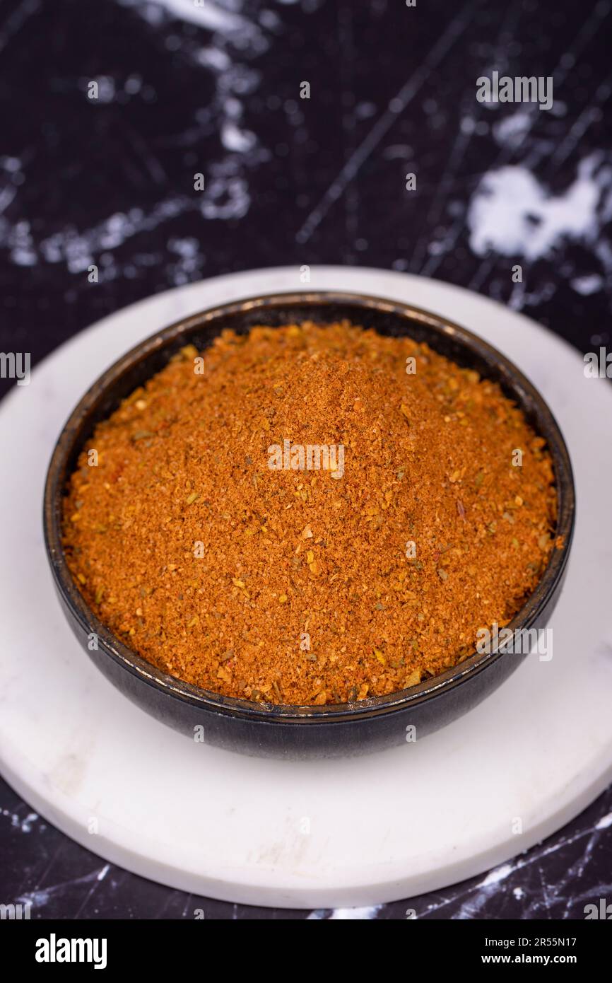 Cajun spice powder on dark background. Powdered dried cajun in bowl ...
