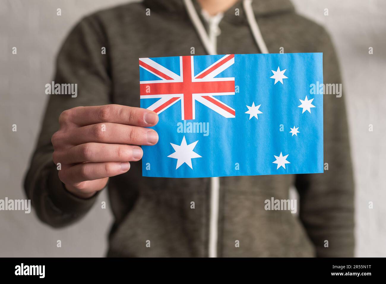 hand holding Australian flag, isolated on white background Stock Photo ...
