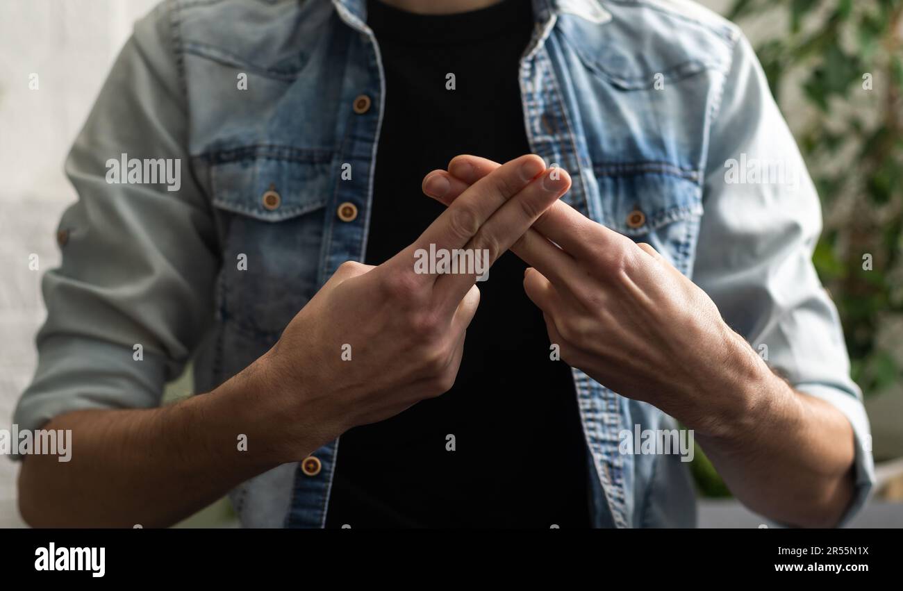 Man showing gesture in sign language on white background Stock Photo ...