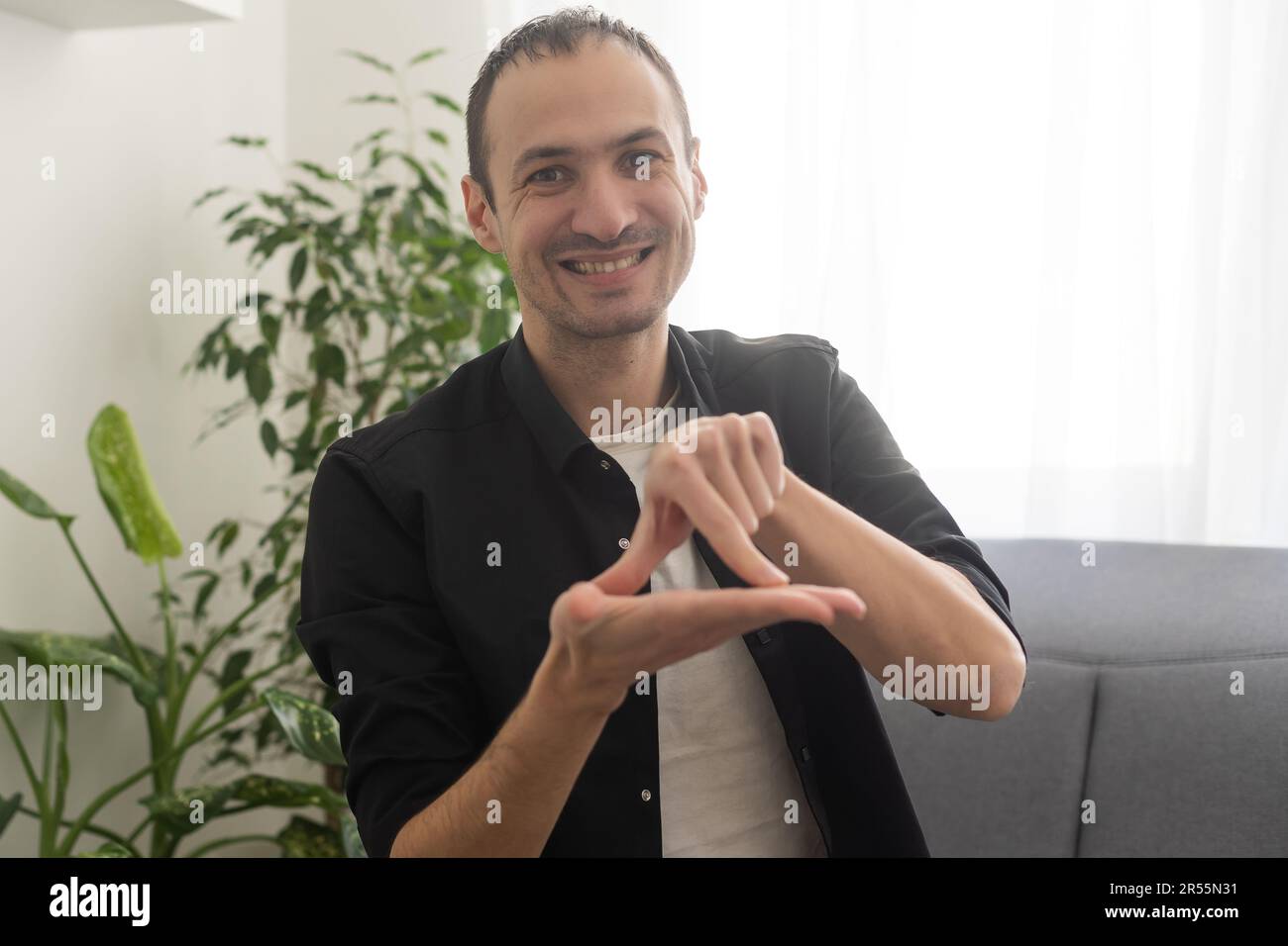 Adult Learning Sign Language For Deaf Disabled Stock Photo - Alamy