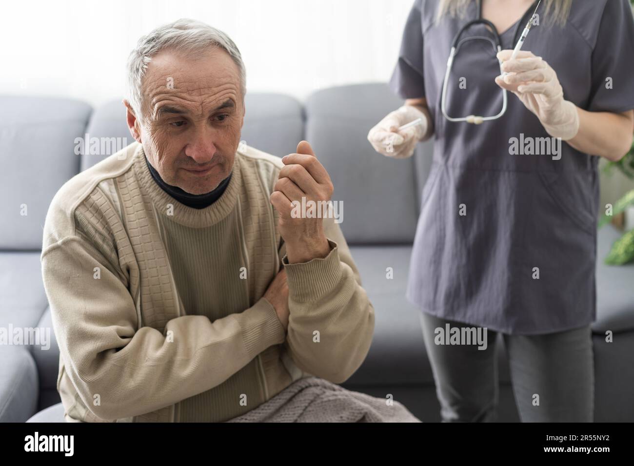 Woman getting vaccine home hi-res stock photography and images - Alamy