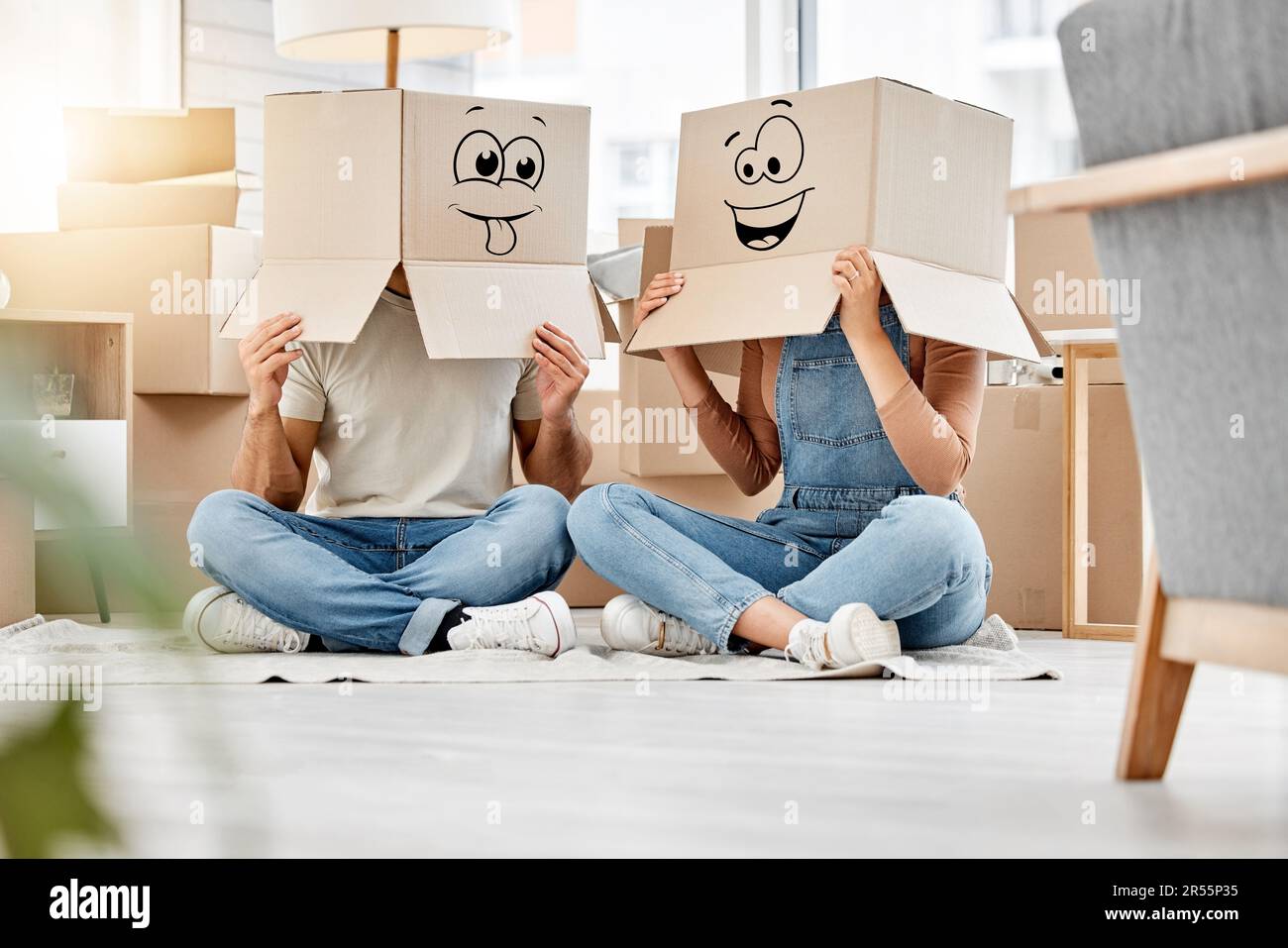 Funny, couple moving and boxes on head with faces, smile or emoji ...