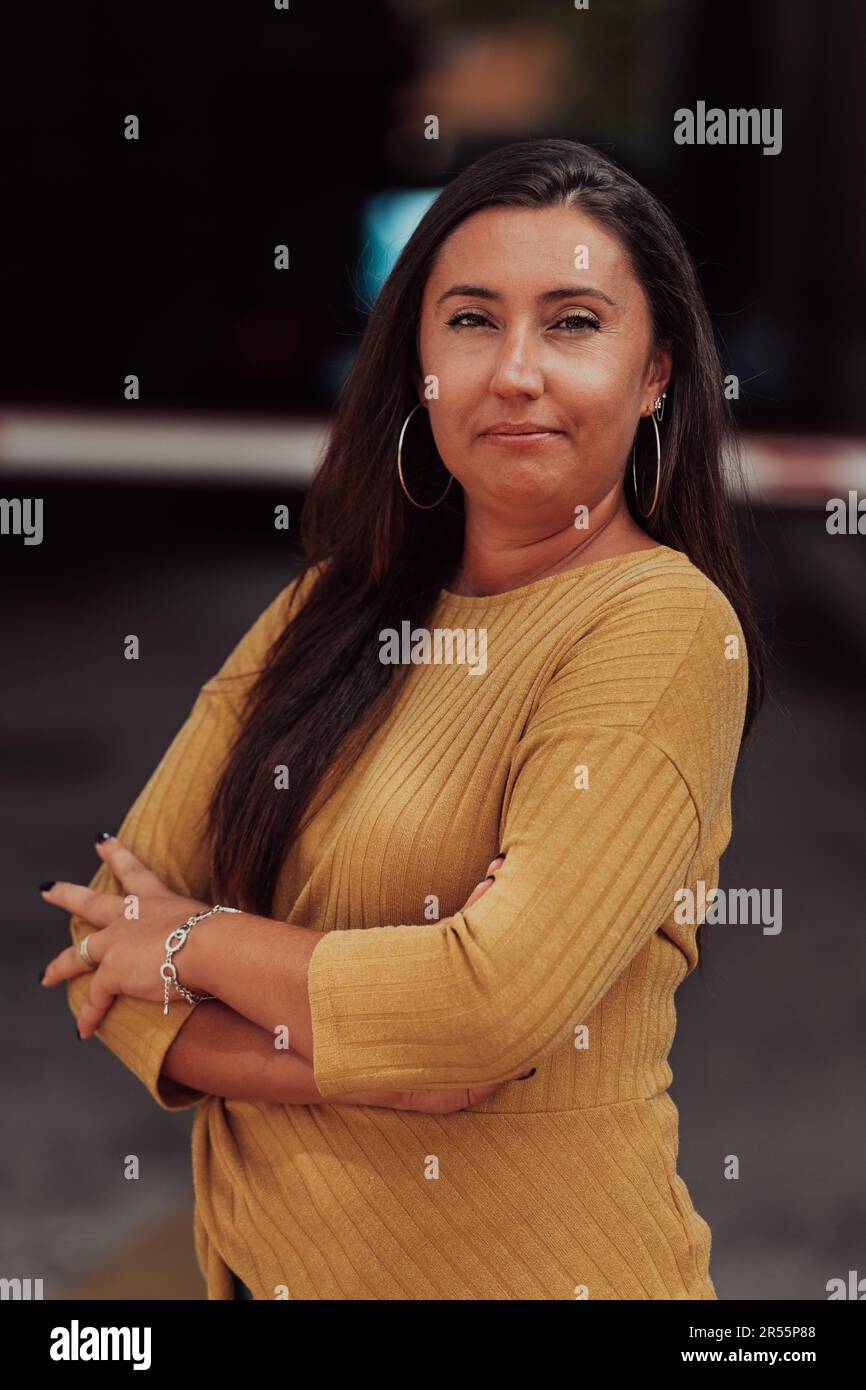 A powerful portrait of a businesswoman, standing confidently with her ...