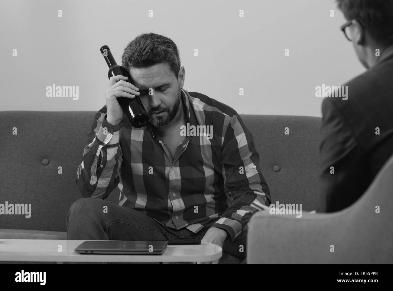 Sad man with psychologist theraphy social problems concept alcohol ...