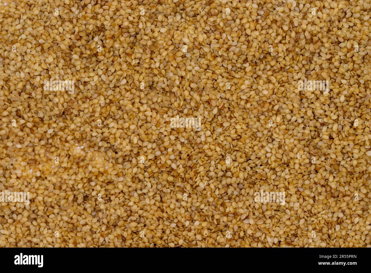 Pile of sesame seeds as background, spice or seasoning as background ...