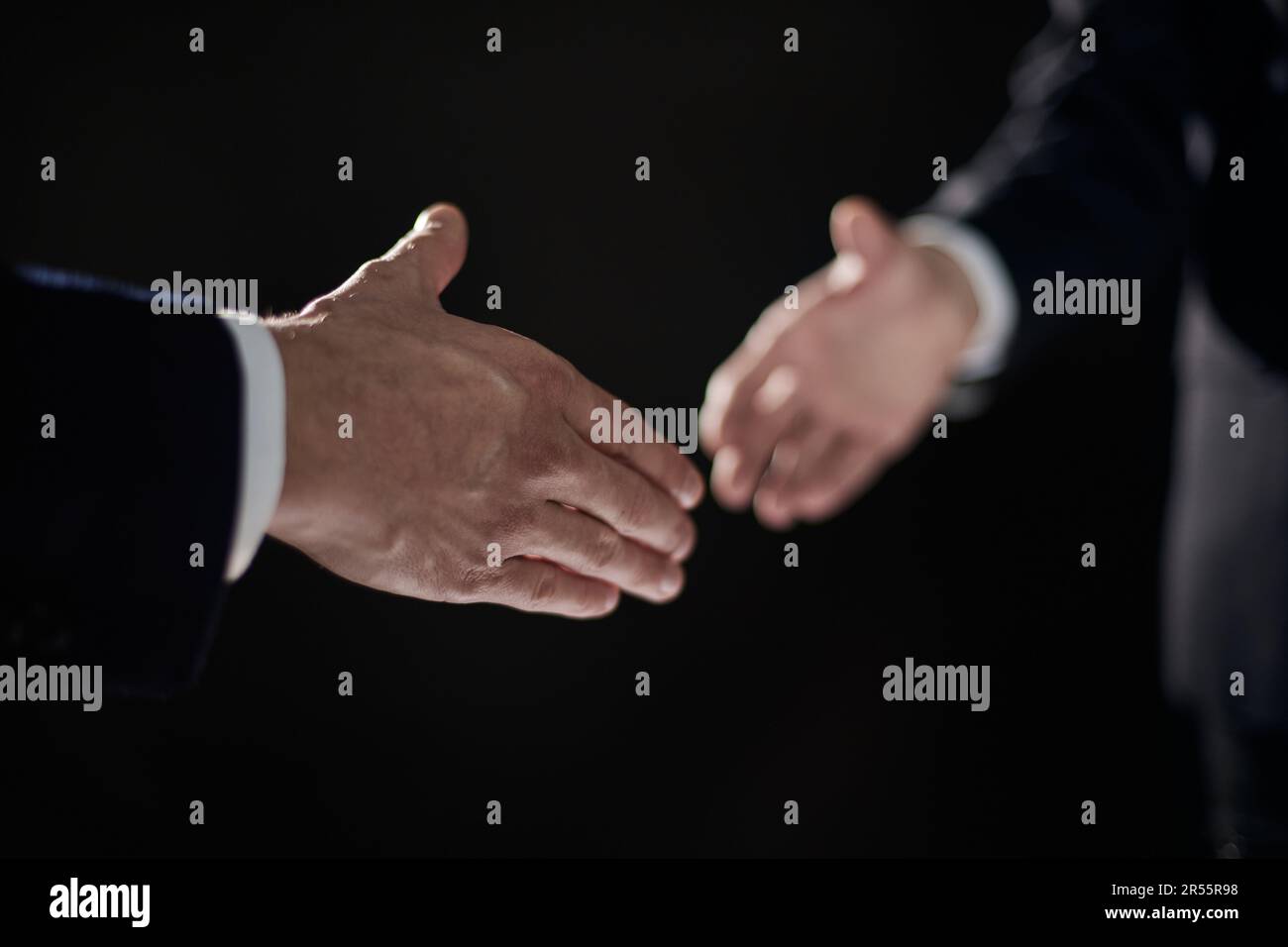 Close-up image of handshake between two colleagues Stock Photo - Alamy