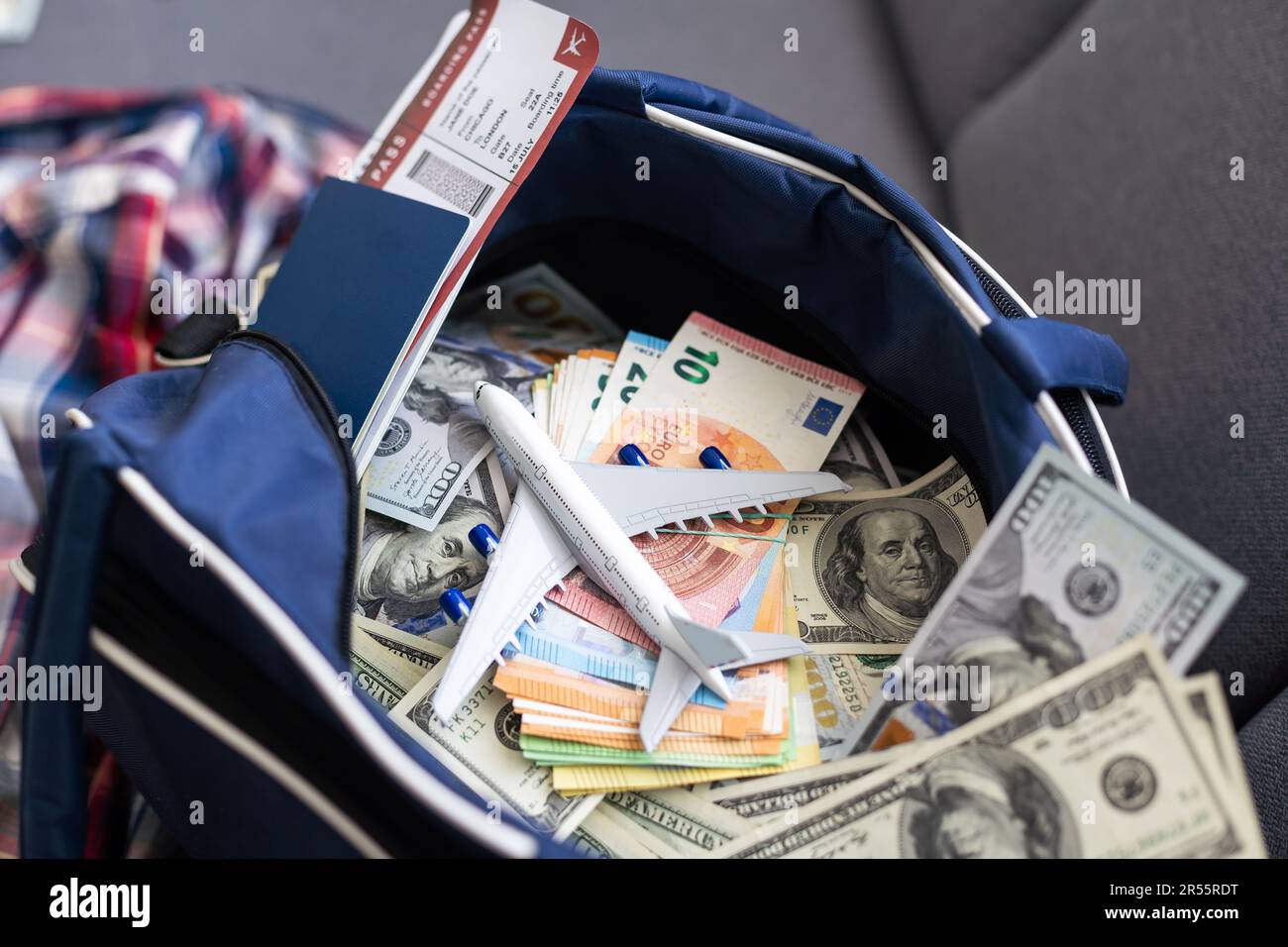 Air tickets, passports, money and toy plane on table Stock Photo - Alamy