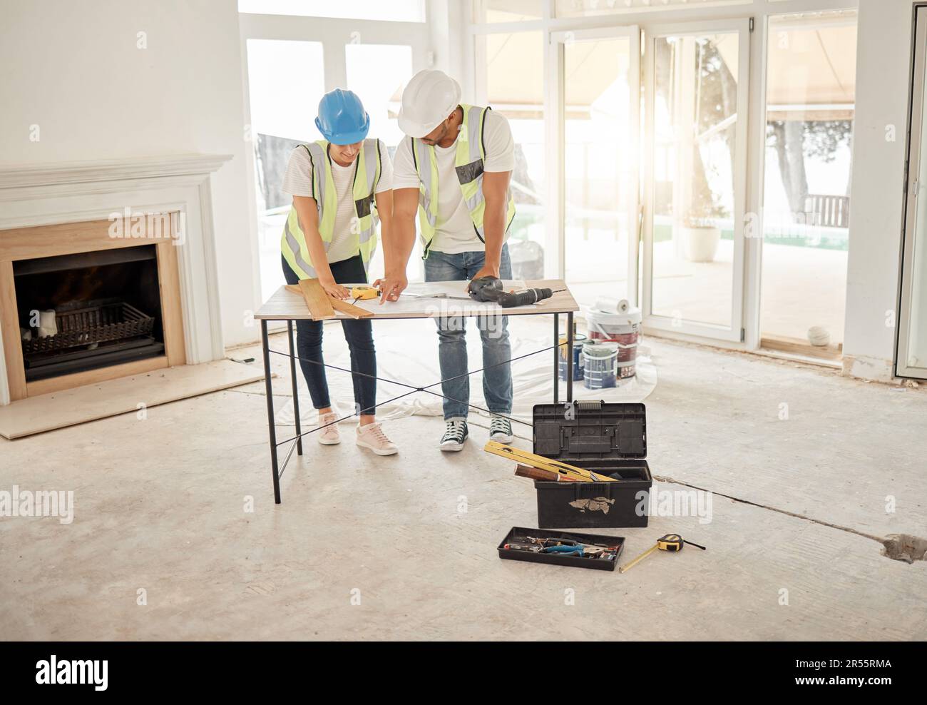 Home renovation, construction and architect team at table for ...