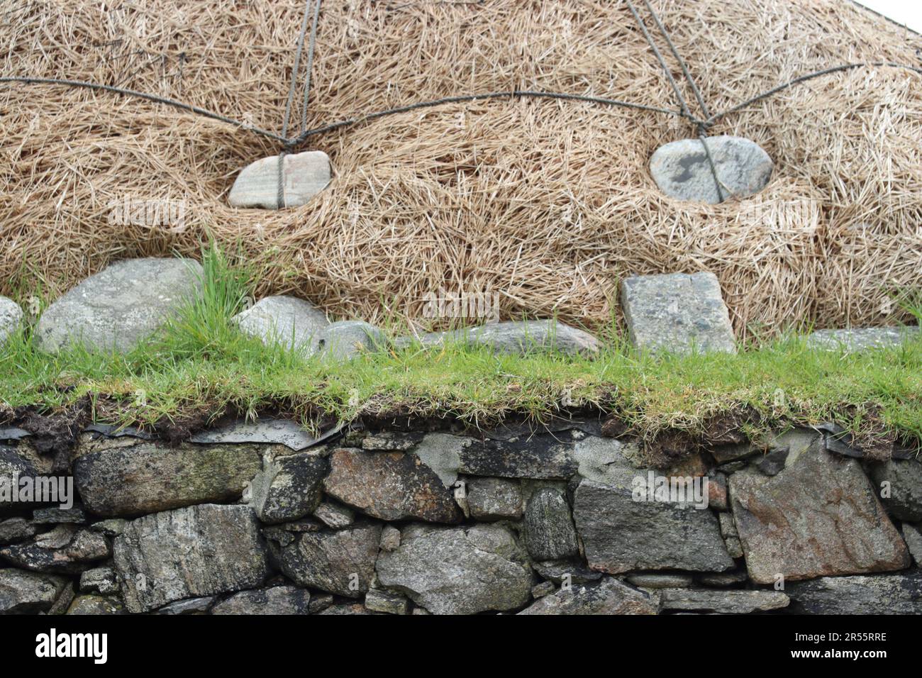Thatched roof and dry stone wall Stock Photo - Alamy
