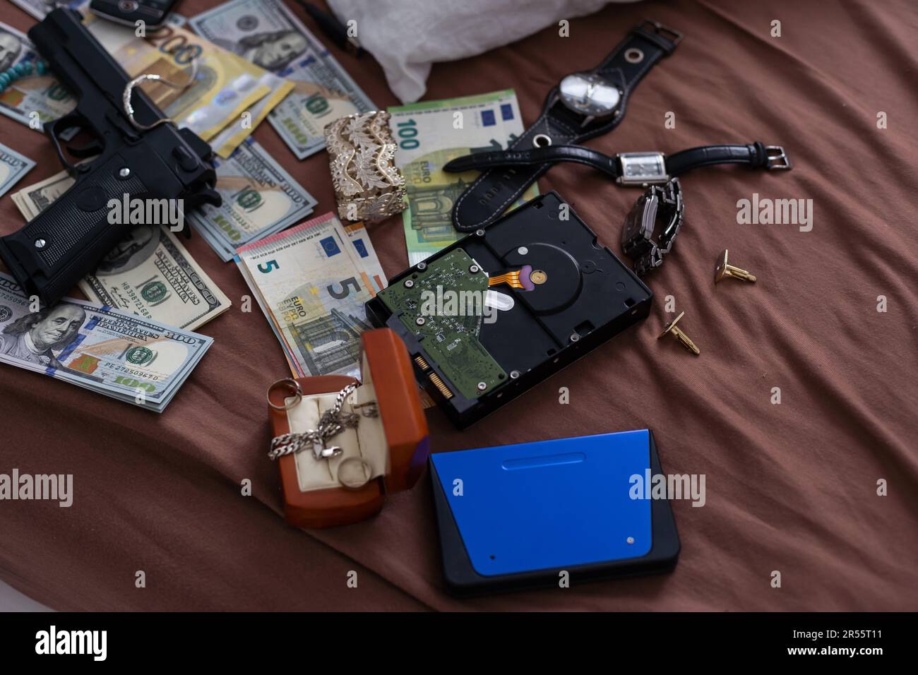 Evidence bag next to dollar banknotes in a crime investigation unit ...