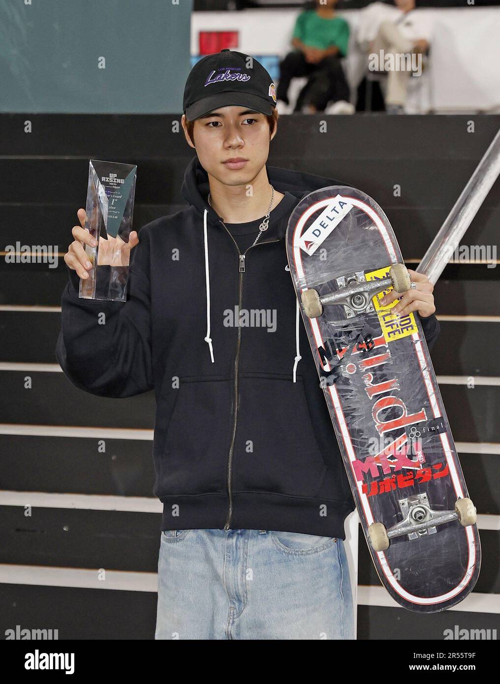 Japan's Yuto Horigome poses with the trophy after winning the men's ...