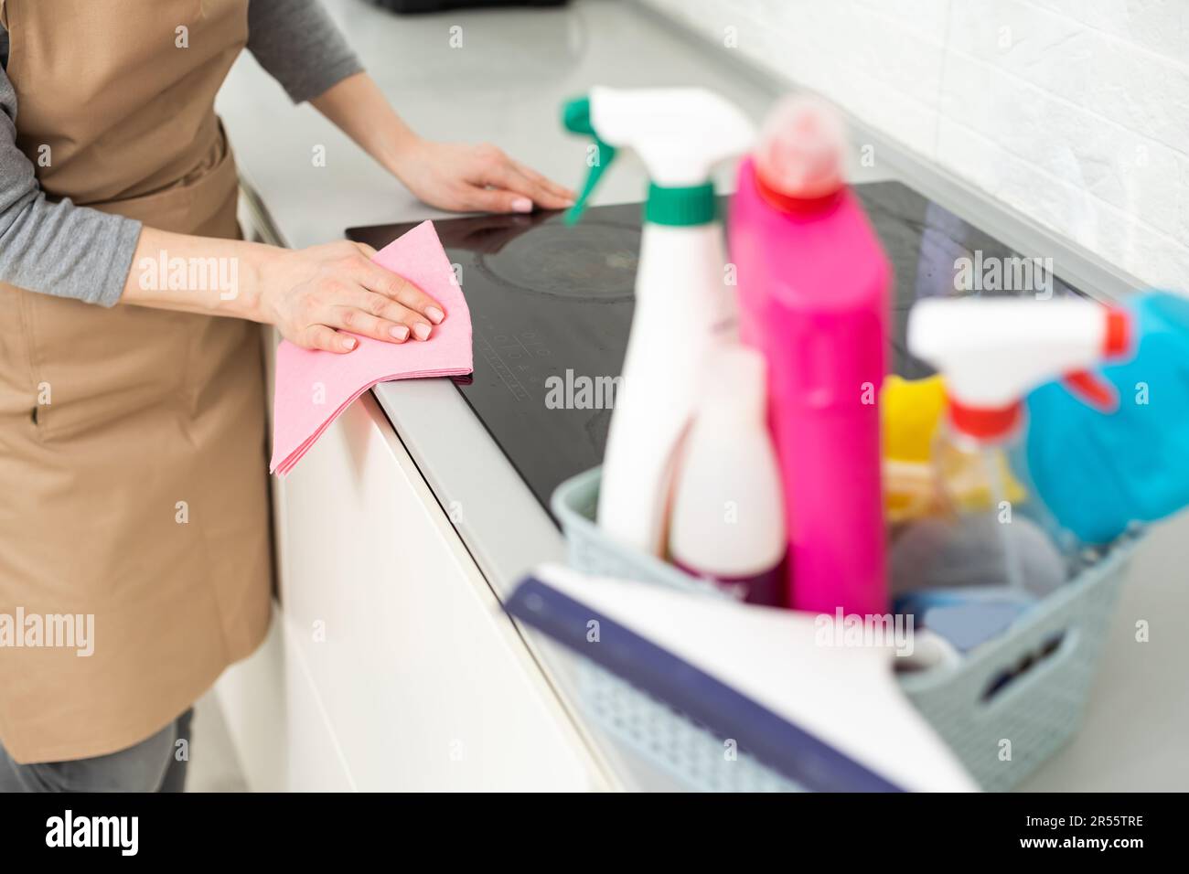 Woman cleaning table using rag and diffuser at home Stock Photo - Alamy