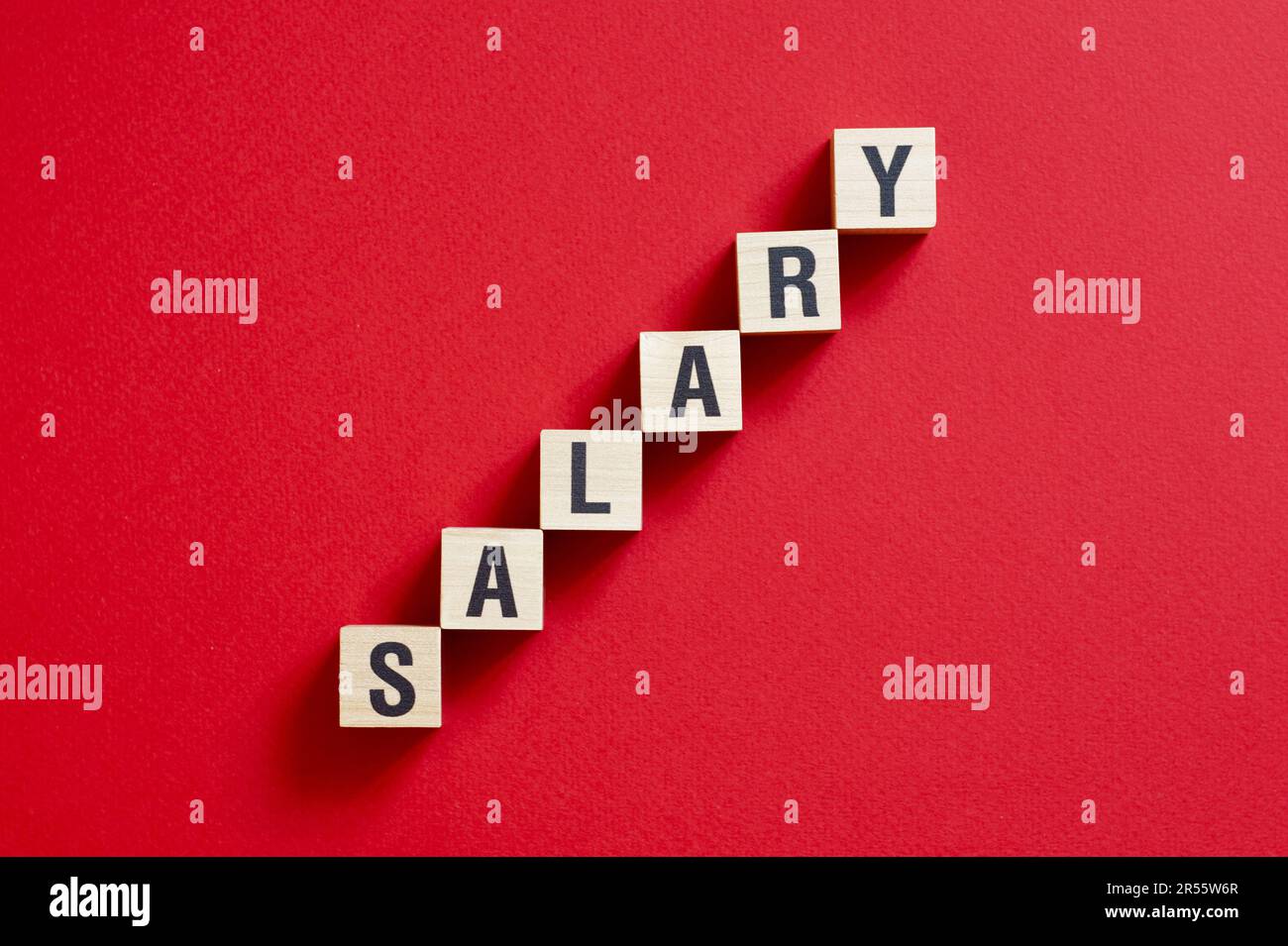 Salary - word concept on cubes, text, letters Stock Photo - Alamy