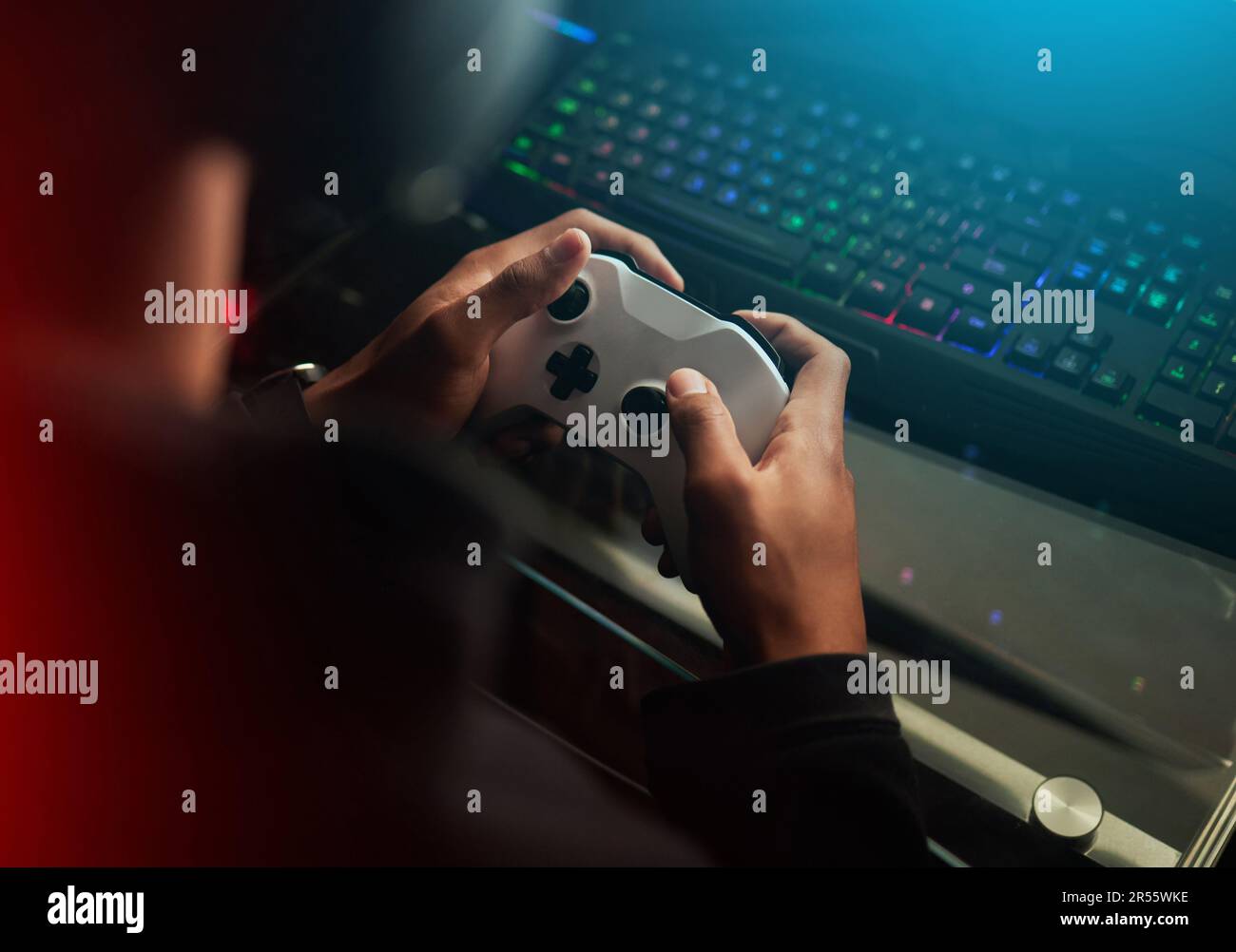 Gaming controller in hands, playing games and online streaming with ...