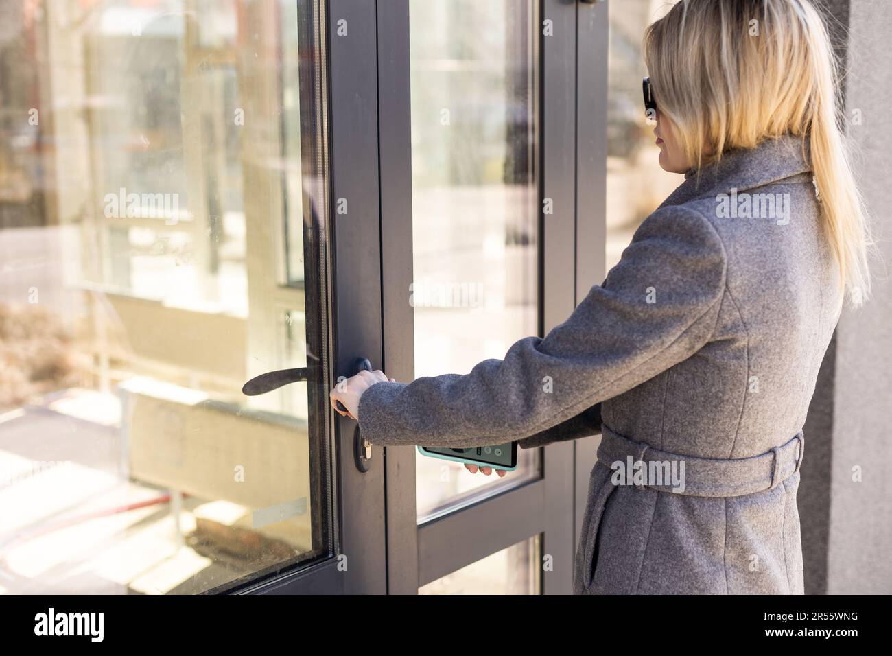 female entering secret key code for getting access and passing building ...