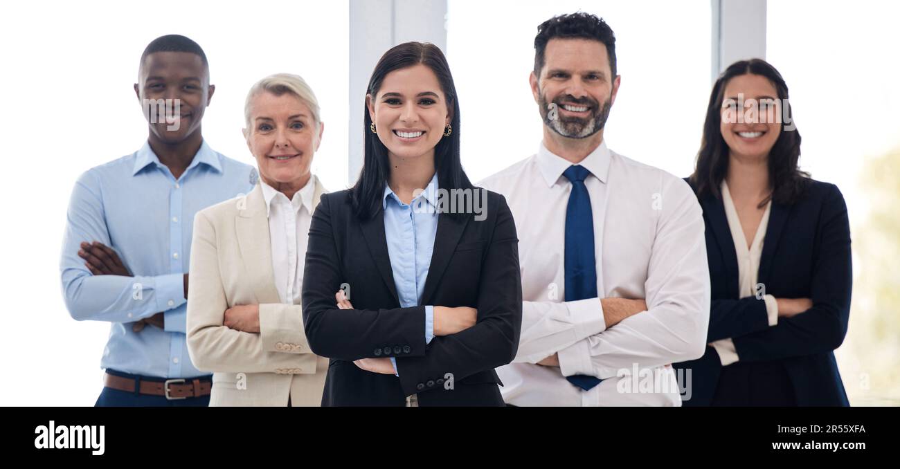 Portrait, management and arms crossed with a business team standing ...