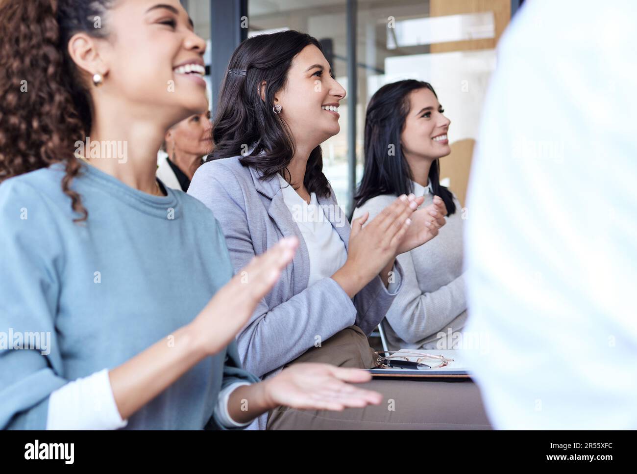 Business people, applause and audience at a conference, seminar or corporate workshop ...