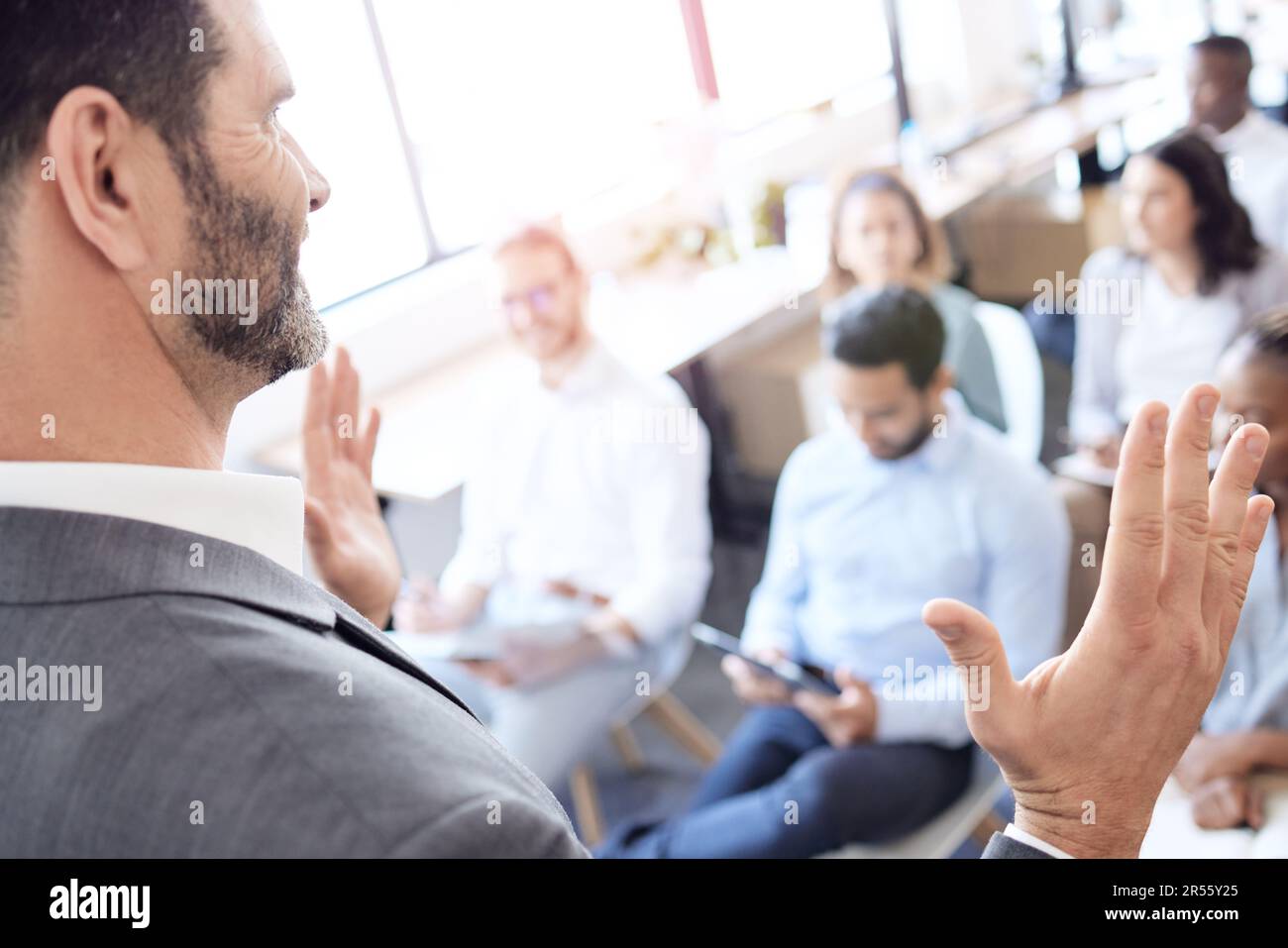Presentation, speaker hands and business people in audience at a ...