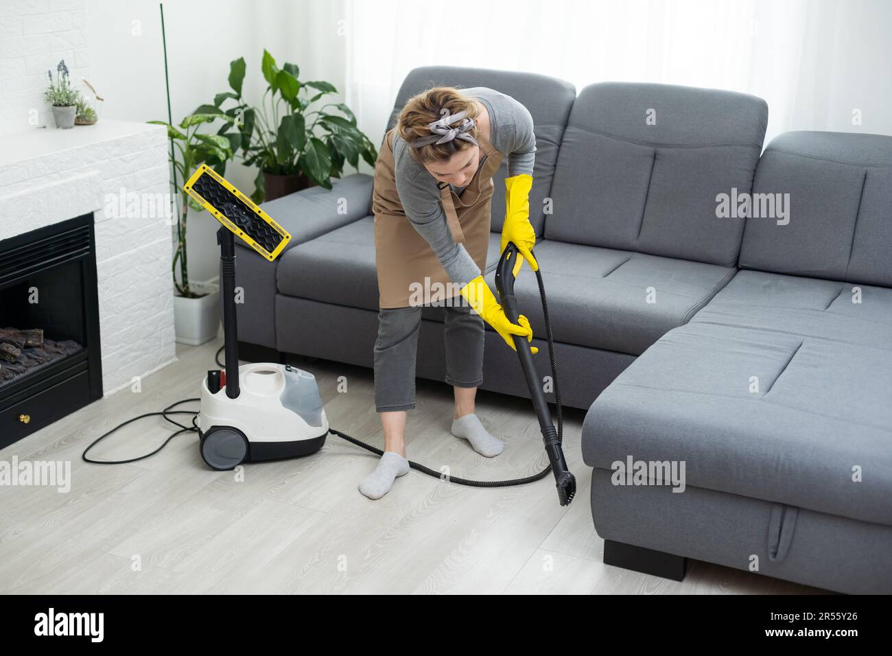 Dry cleaners man employee removing hi-res stock photography and images ...