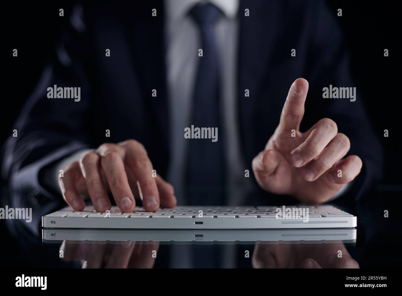typing on the keyboard thumbs up close up Stock Photo - Alamy