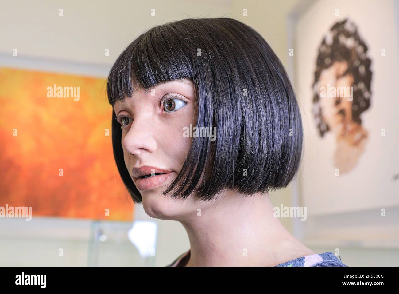 London, UK, 01st June 2023. Ai-Da with artwork and a self-portrait she ...