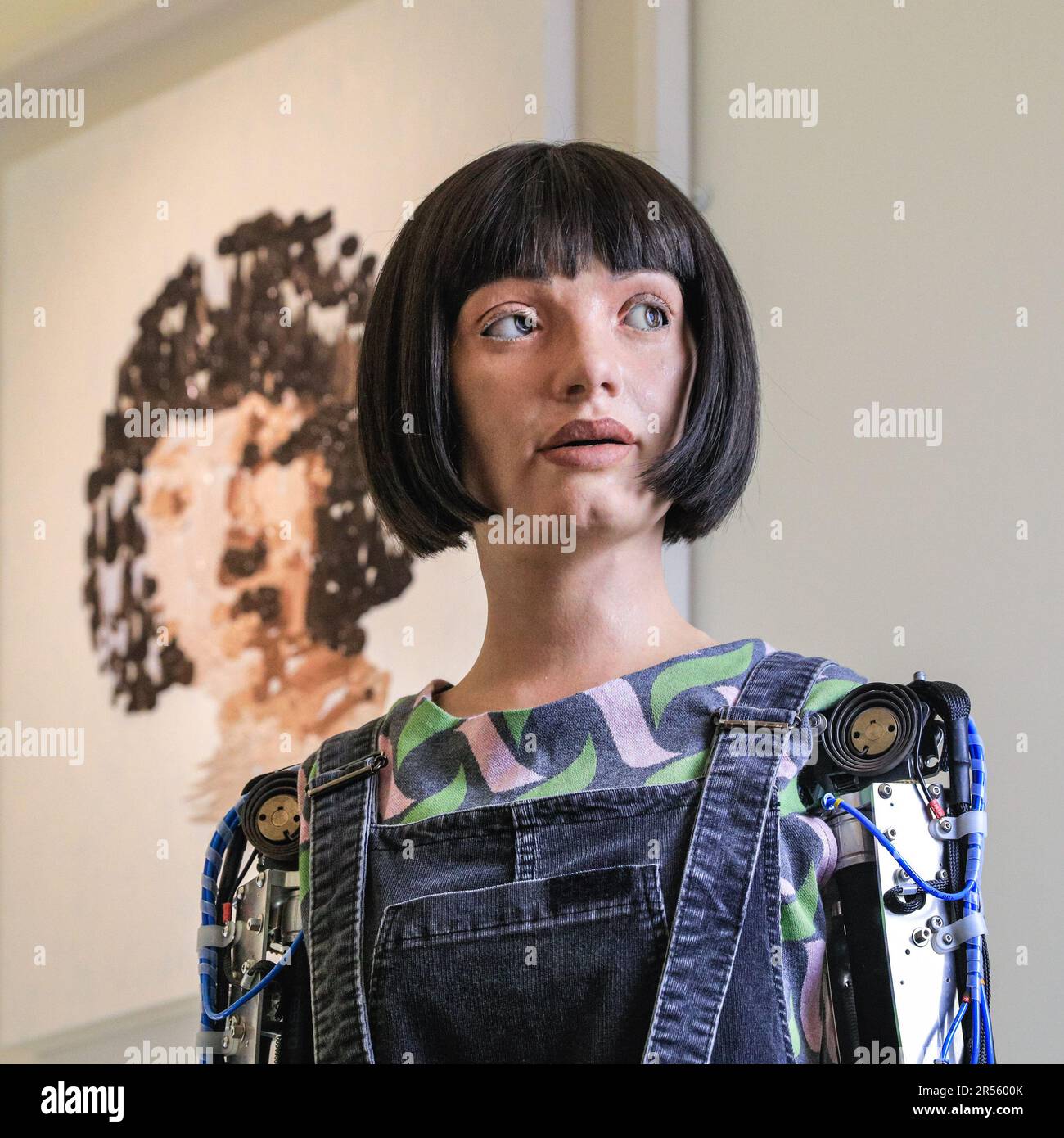 London, UK, 01st June 2023. Ai-Da with artwork and a self-portrait she ...
