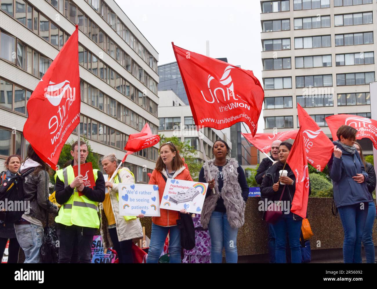 Unite union members hold union flags at the picket line outside St ...