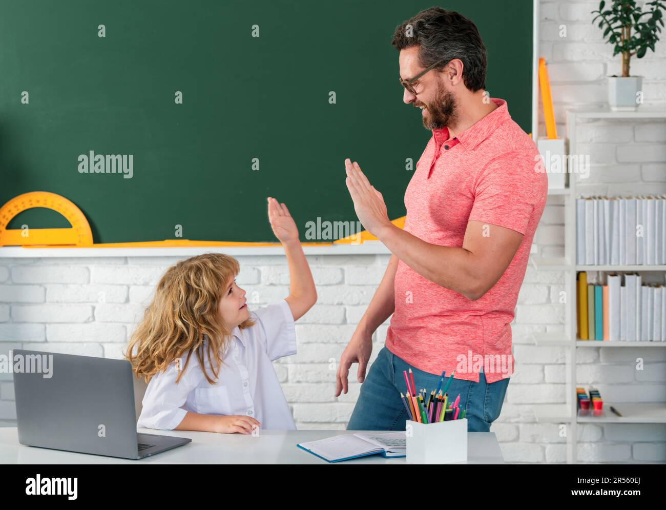 Kid boy learning with teacher. Funny little boy study with father in ...