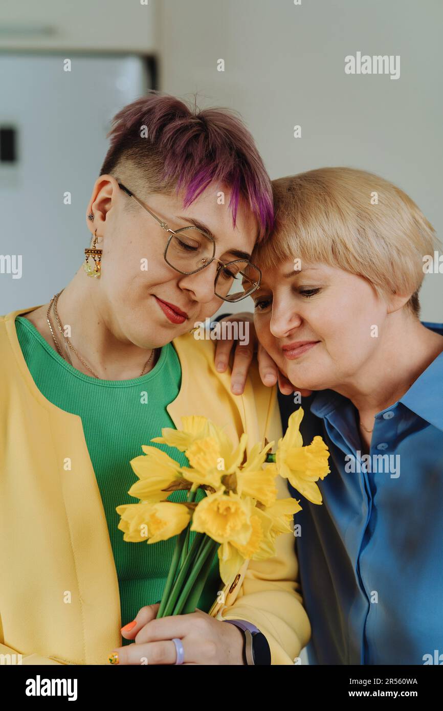 Daughter's Warm Hug and Floral Present on Mother's Day, Women's Day ...