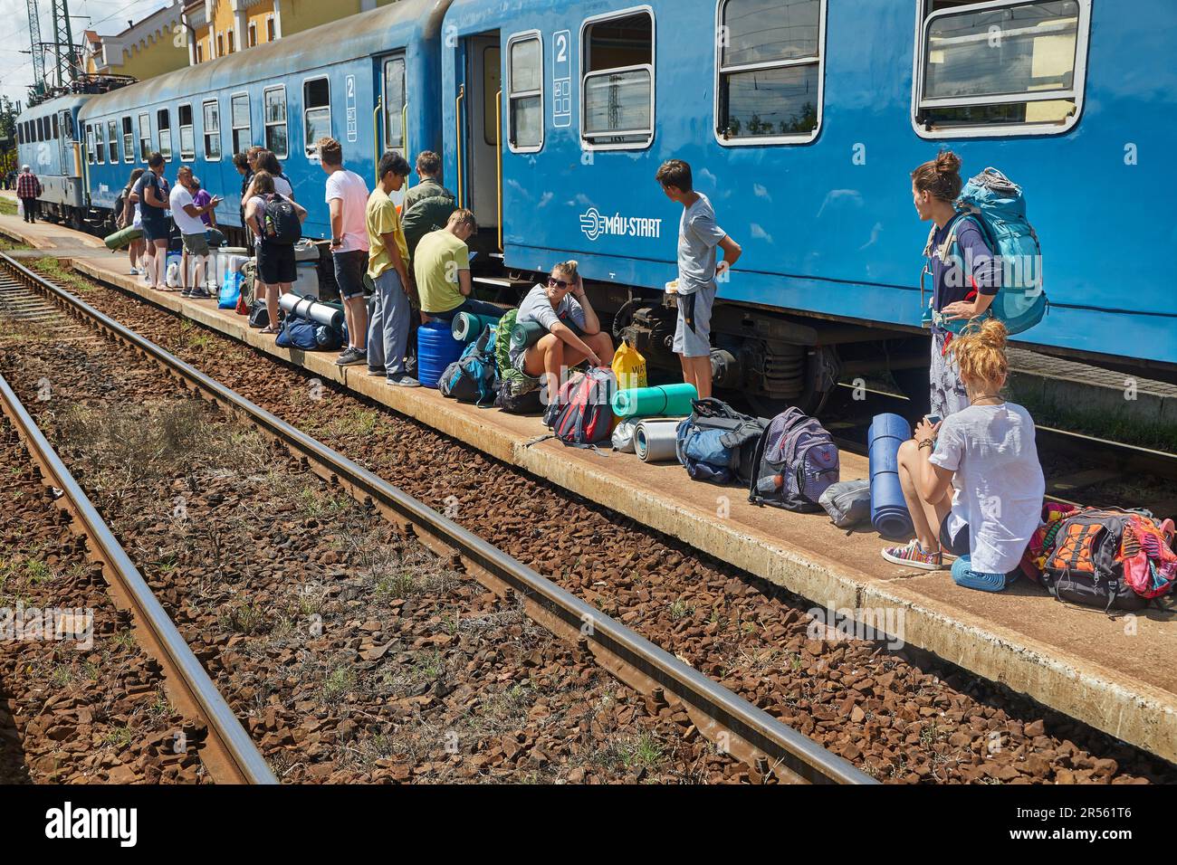 Group of students boarding a train Stock Photo - Alamy