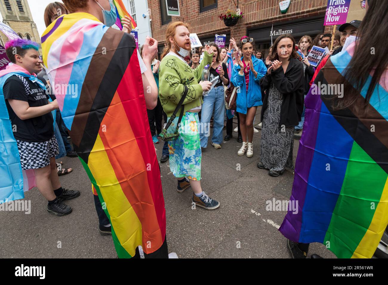 A group of pro-trans rights advocates are peacefully protesting outside ...