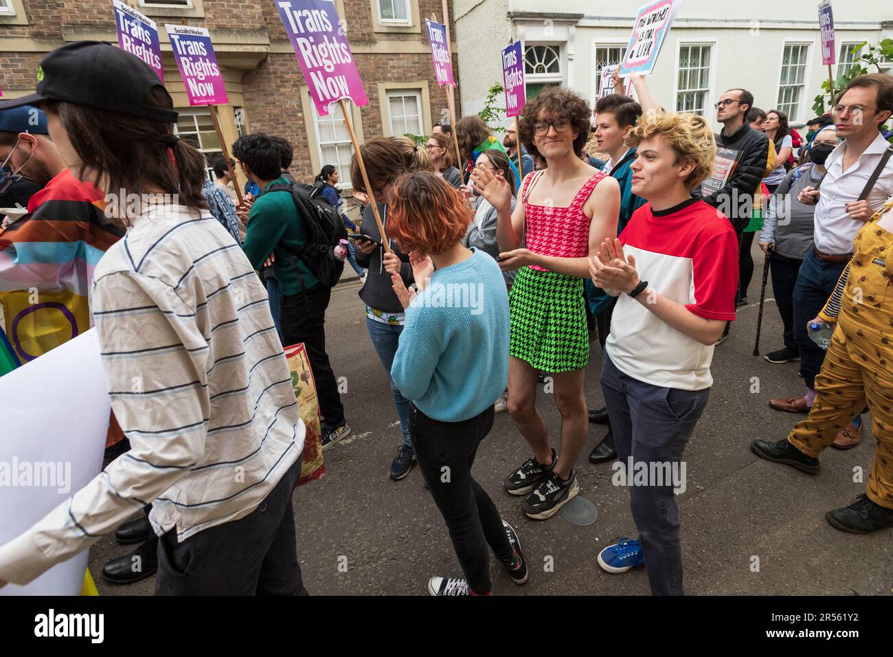 A group of pro-trans rights advocates are peacefully protesting outside ...