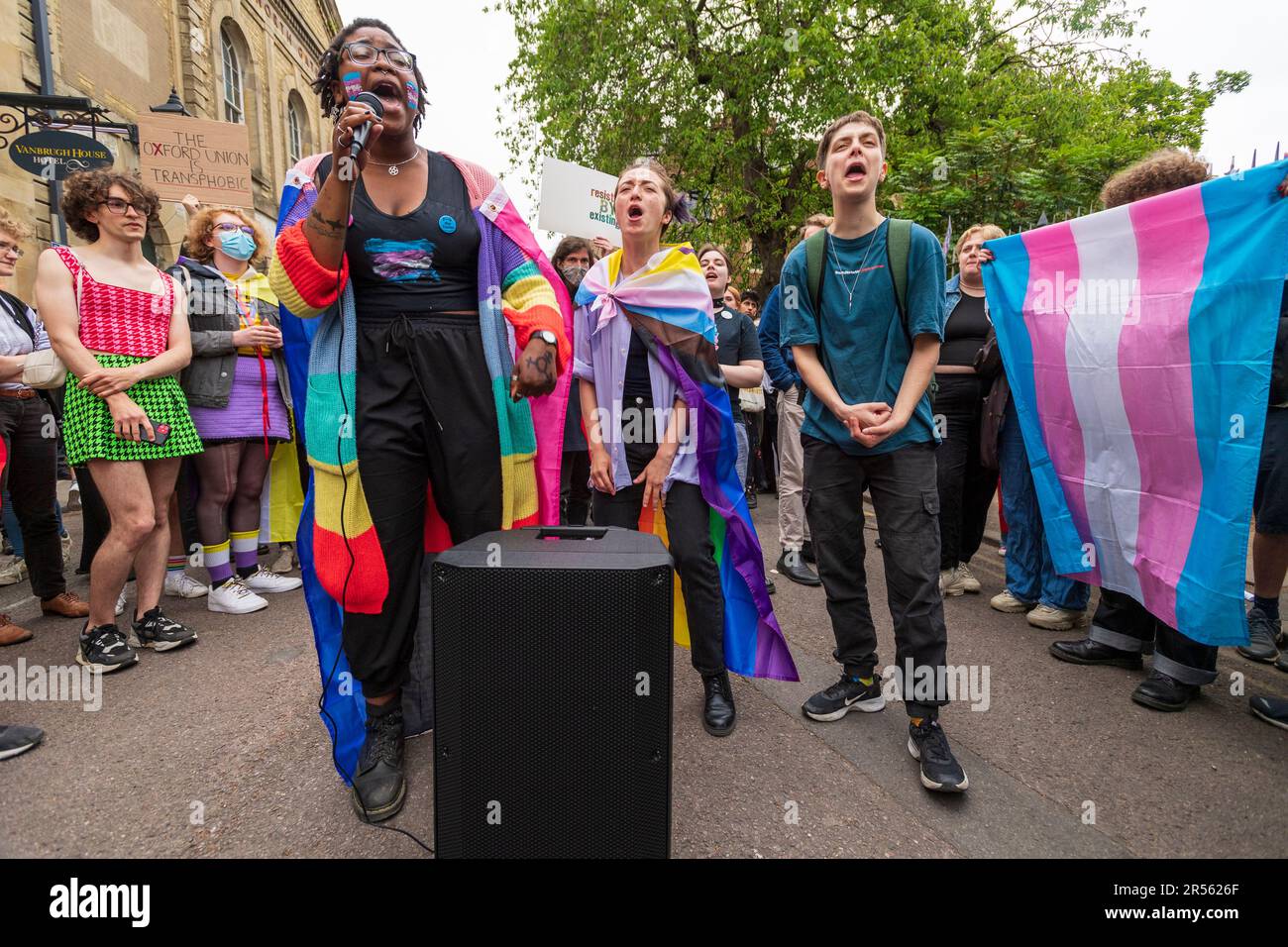 A group of pro-trans rights advocates are peacefully protesting outside ...
