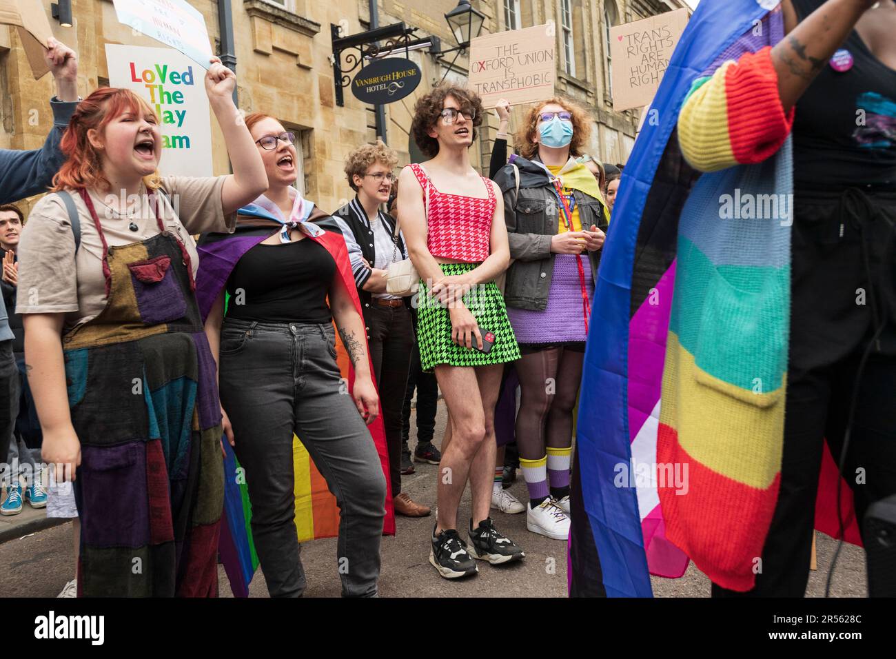 A group of pro-trans rights advocates are peacefully protesting outside ...
