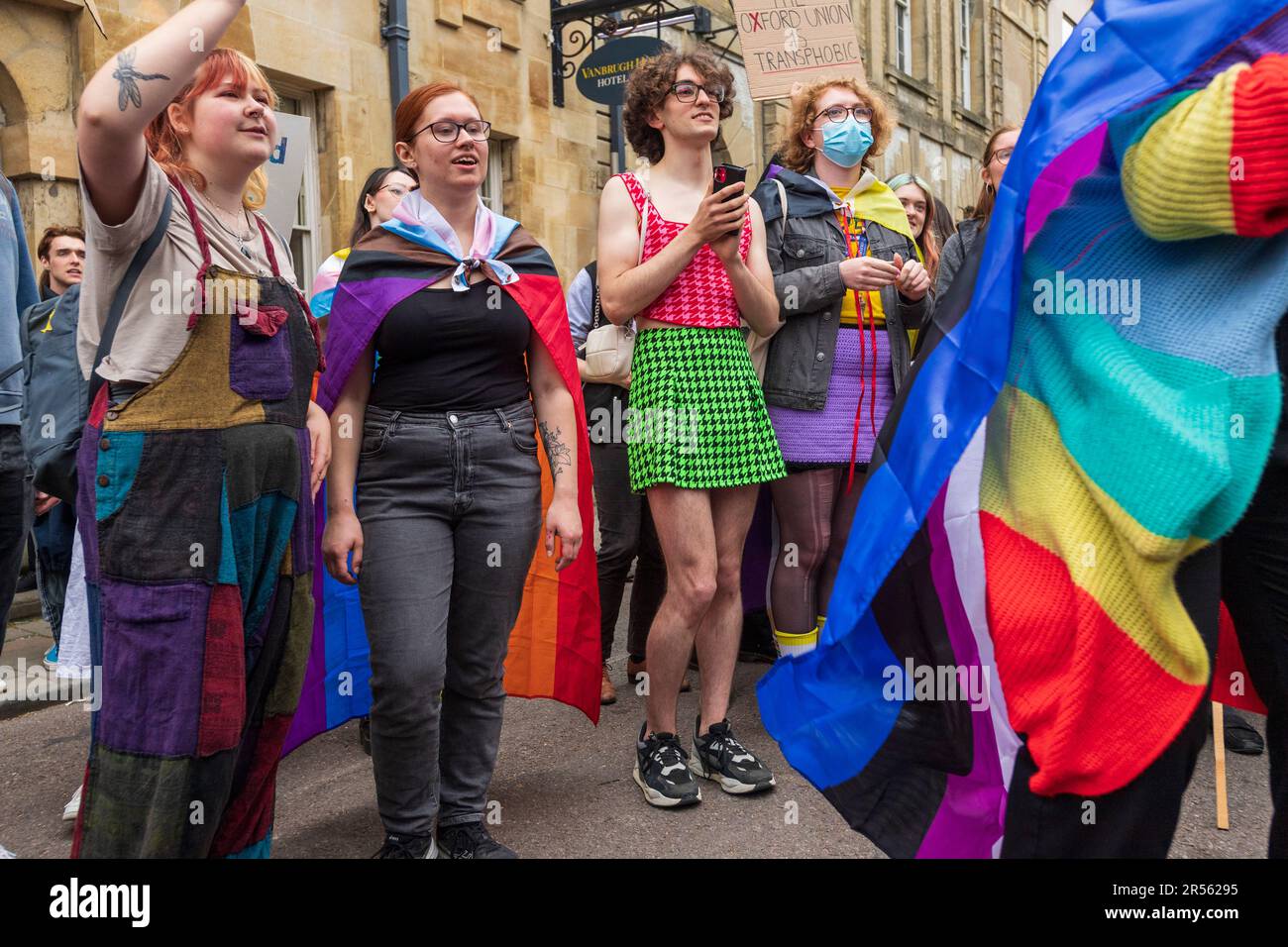 A group of pro-trans rights advocates are peacefully protesting outside ...