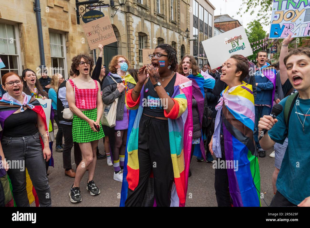 A group of pro-trans rights advocates are peacefully protesting outside ...