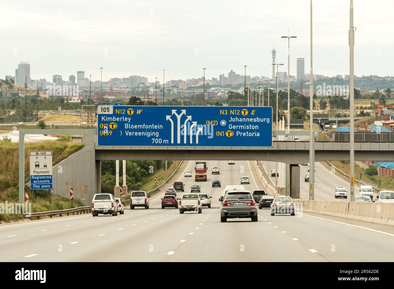 Johannesburg city skyline in the distance taken on a toll road or ...