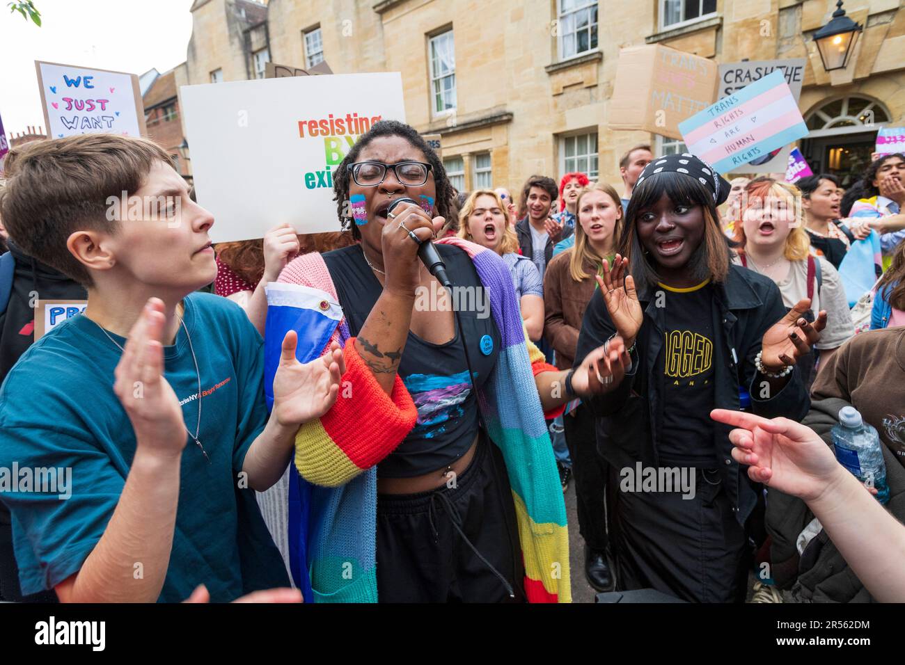 A group of pro-trans rights advocates are peacefully protesting outside ...