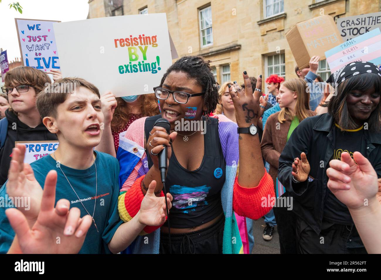 A group of pro-trans rights advocates are peacefully protesting outside ...