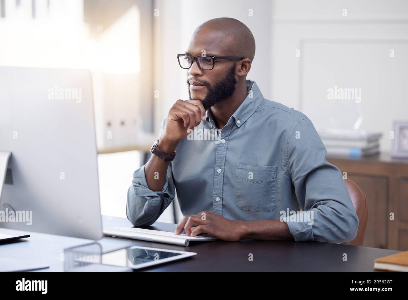 Thinking, computer and business man for IT solution, problem solving ...