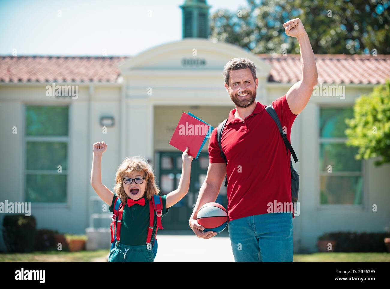 Amazed father walking son to school. Parent and pupil of primary school ...