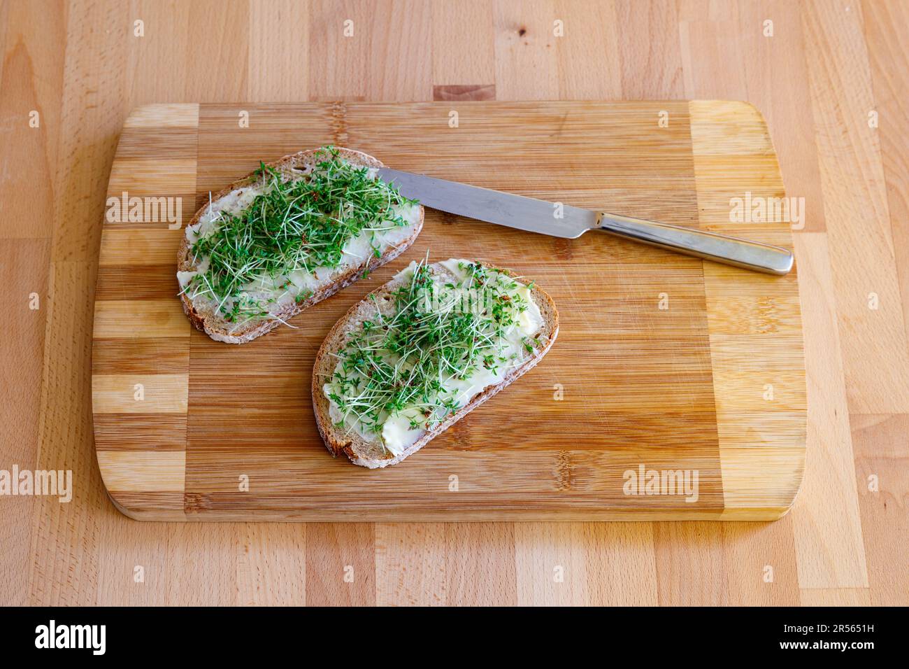 Slice of bread with butter and herbs Stock Photo - Alamy