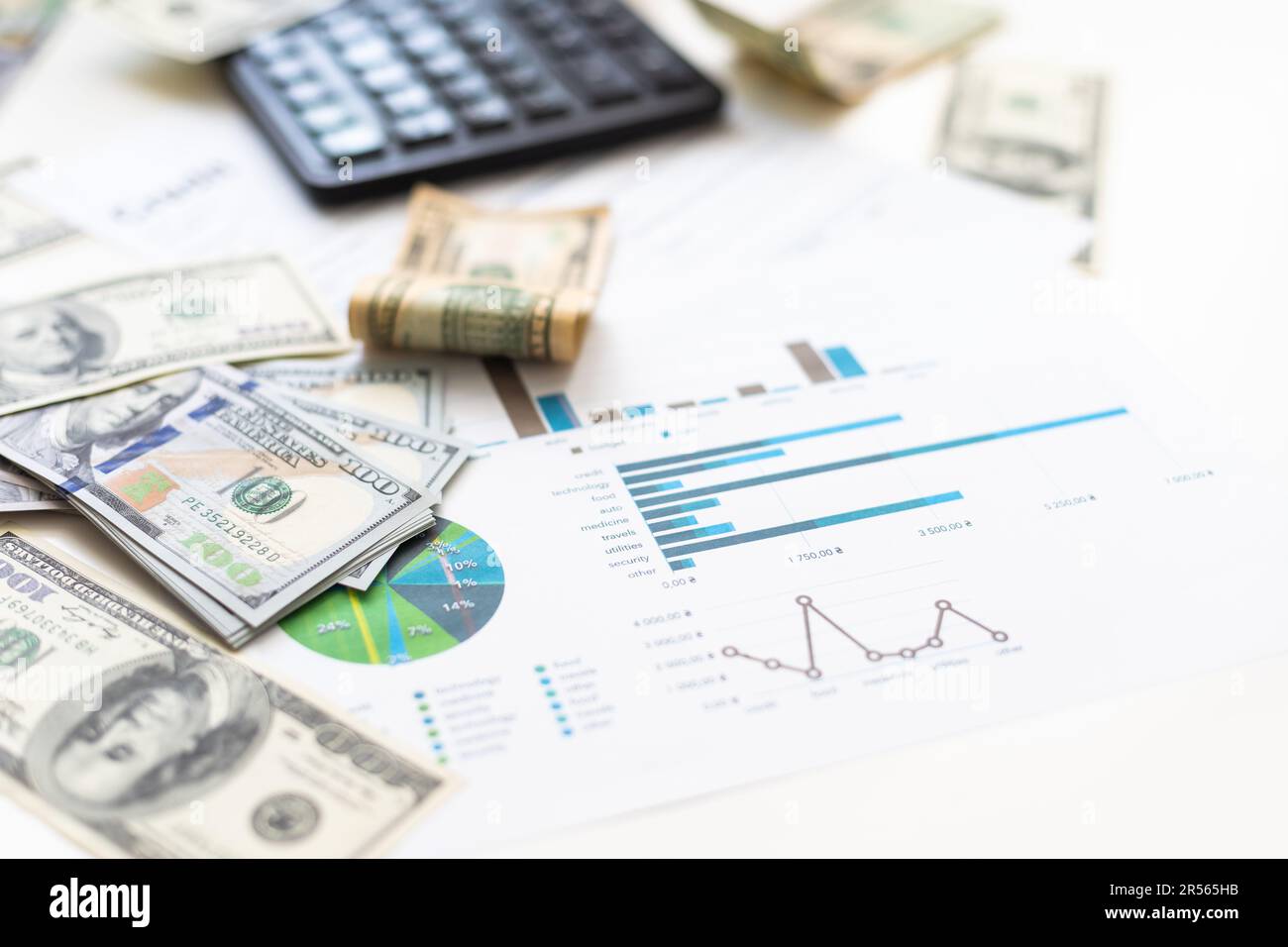Accounting charts and graphs with us dollar bills pen calculator. Stock ...